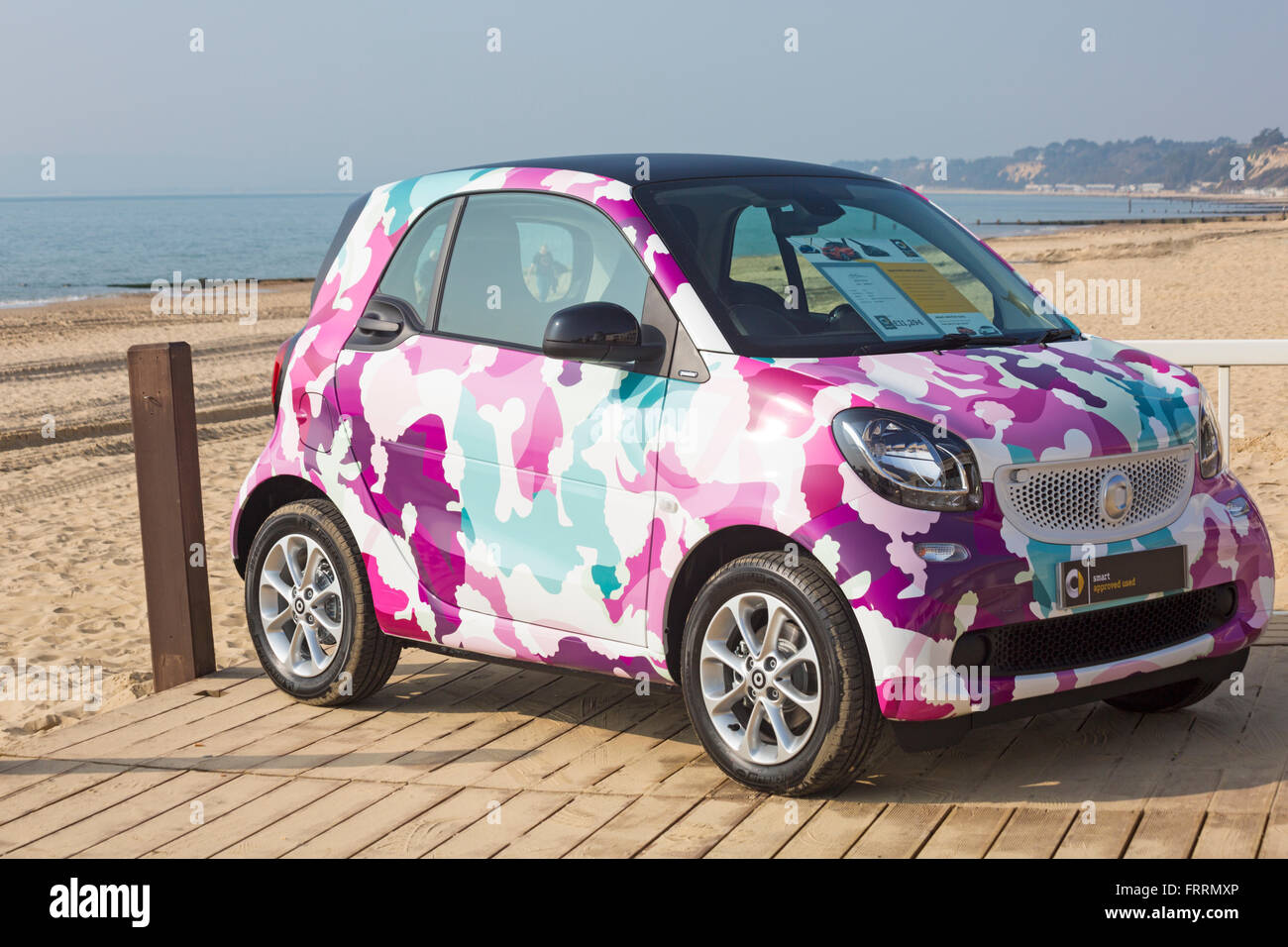 Colourful Smart fortwo car on display at Bournemouth beach, Dorset UK ...
