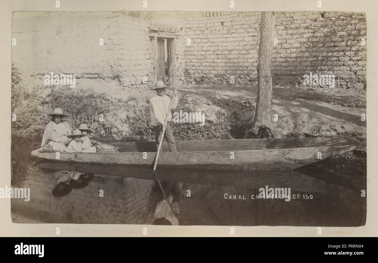 A photograph showing a canal in Ixtacalco, Mexico, with boats and ...