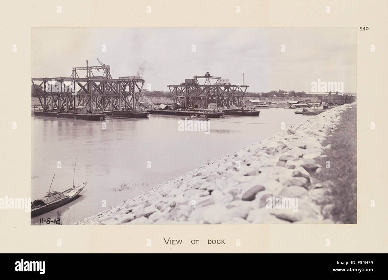 The photograph shows a view of dock bridges under construction, part of ...