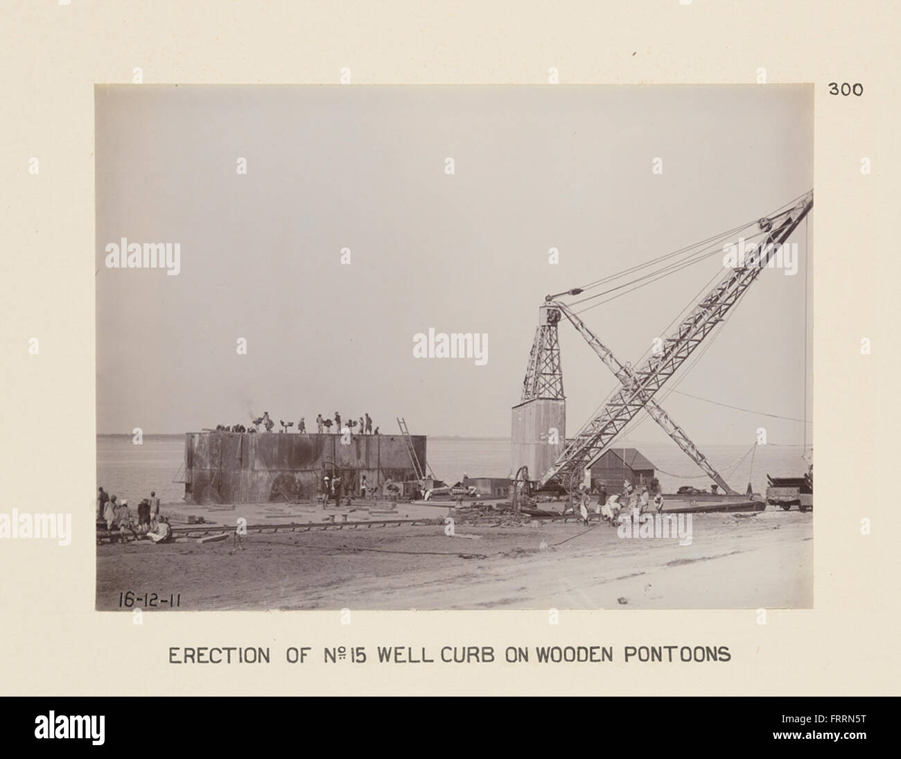 The erection of a well curb on wooden pontoons as part of the bridge ...