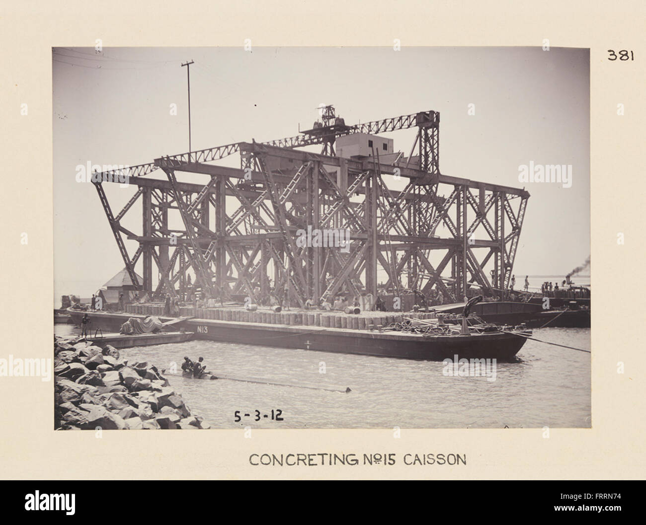 A photo of workers concreting the No. 15 Caisson during railroad bridge ...
