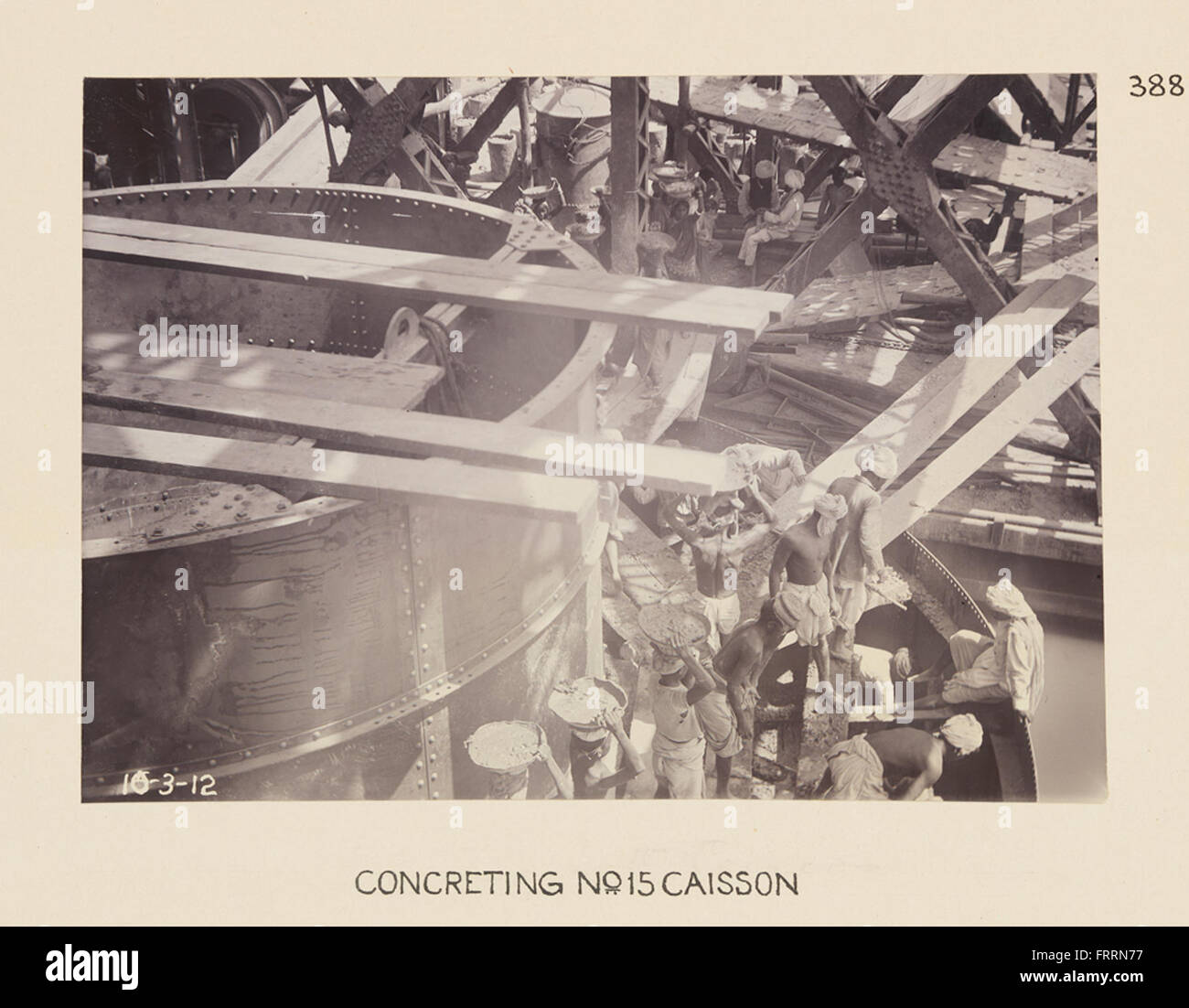 A photograph showing the concreting process of a caisson at a railroad ...