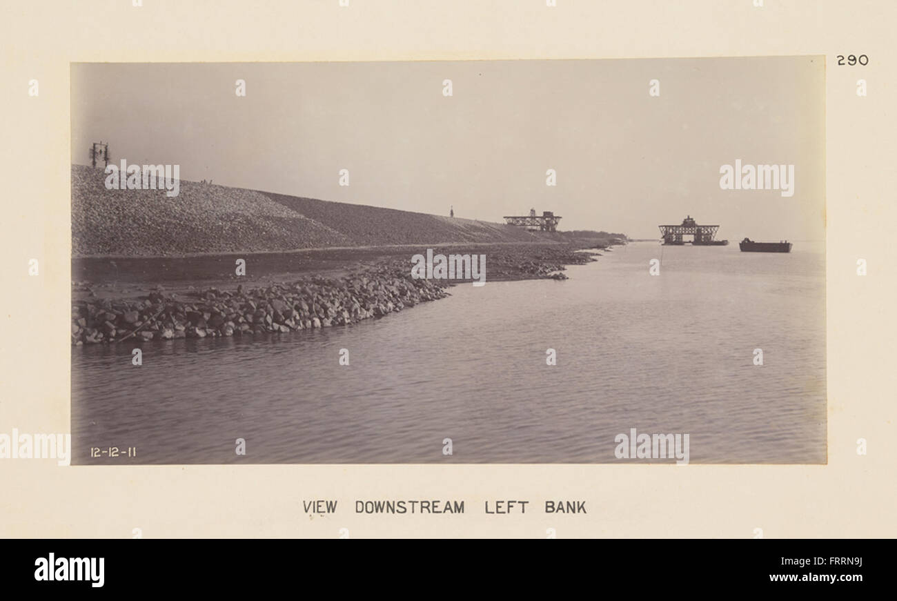 A photograph showing the downstream view from the left bank of a river ...