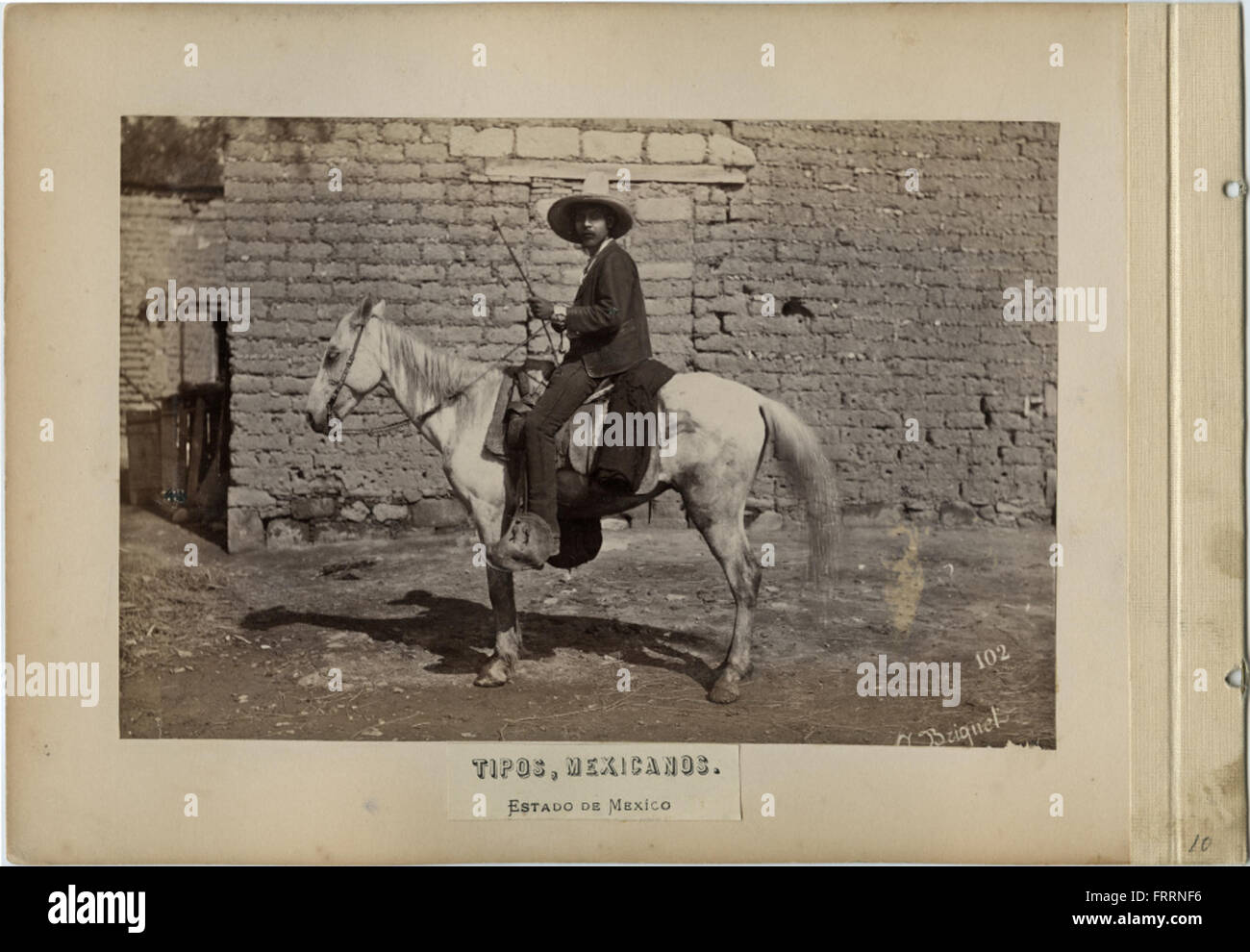A photograph showing Mexican men riding horses, capturing traditional ...