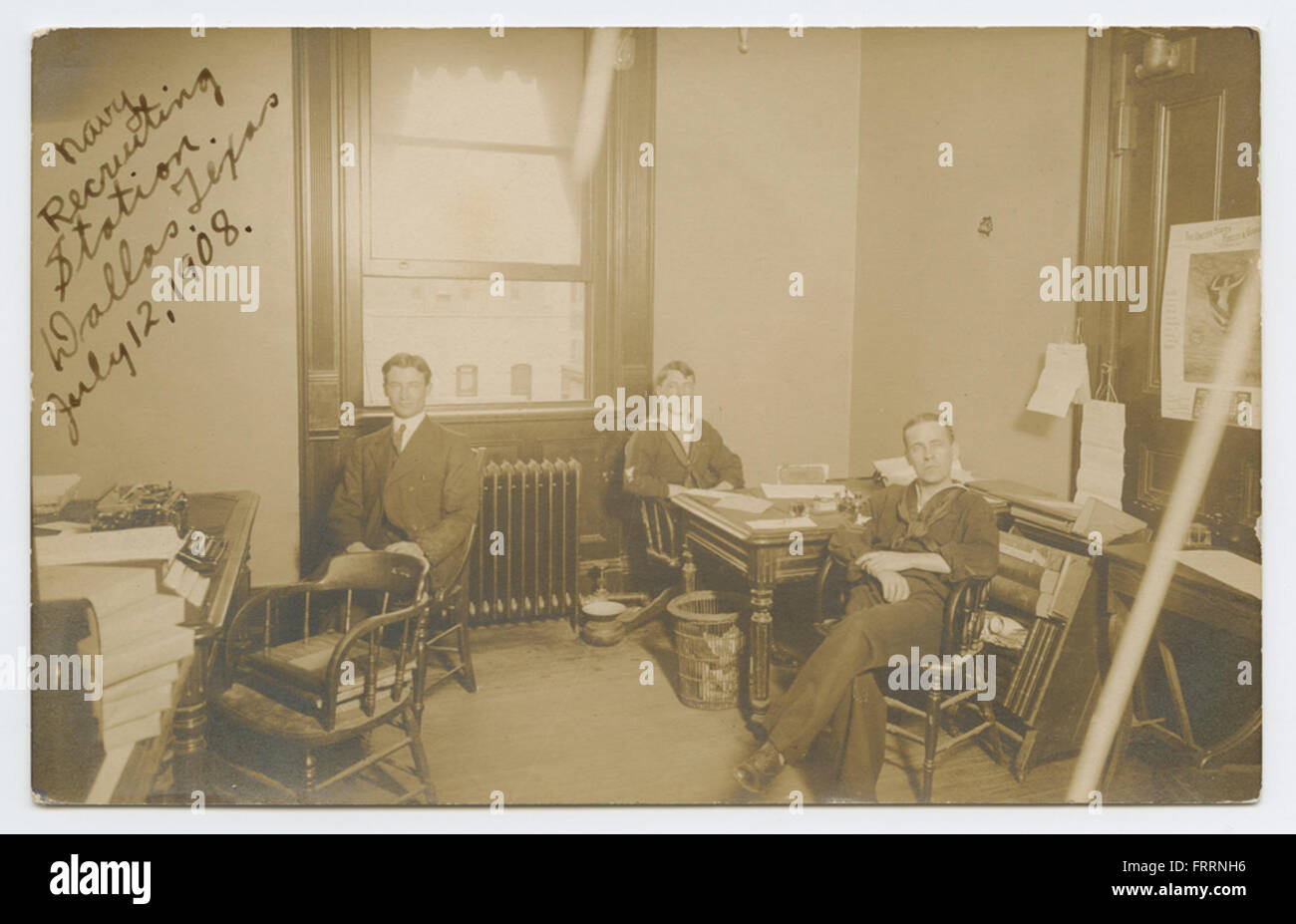 A photograph of a U.S. Navy recruiting station, showing men in uniform ...