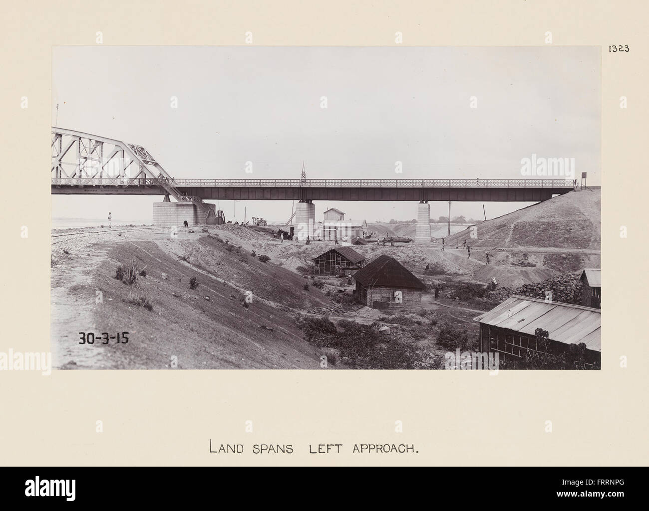 The photograph shows the land spans of the left approach to a railroad ...