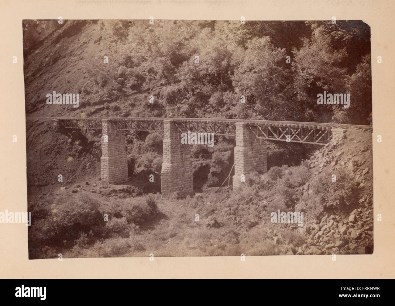 A railroad bridge spanning a body of water, showing the structure and ...