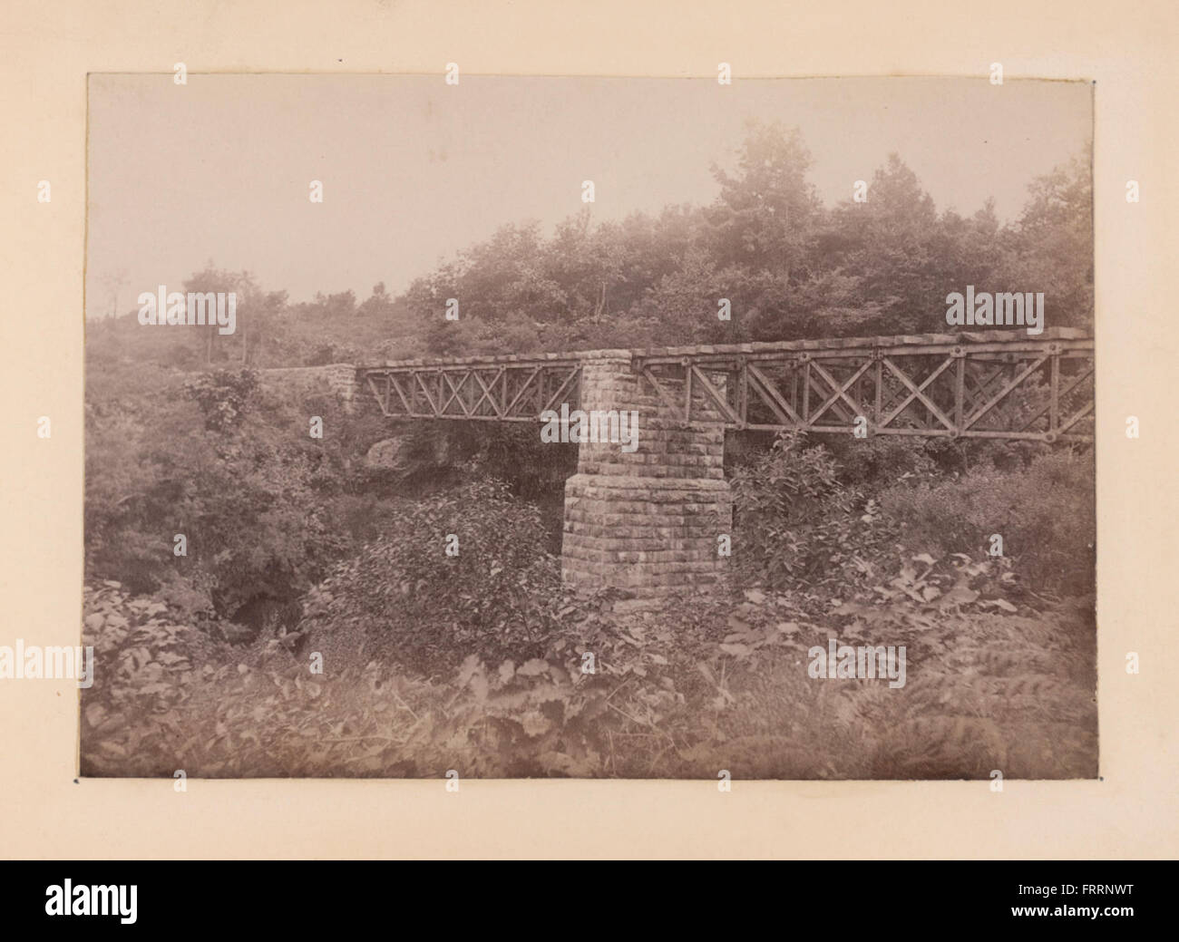 A photograph of a railroad bridge under construction, focusing on the ...