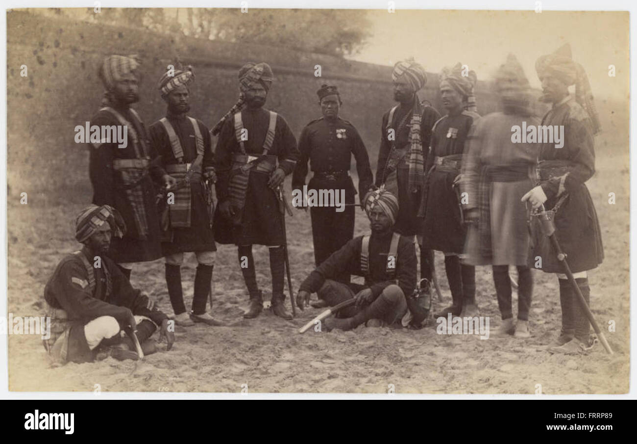 A photograph of orderlies serving foreign officers, likely during a ...