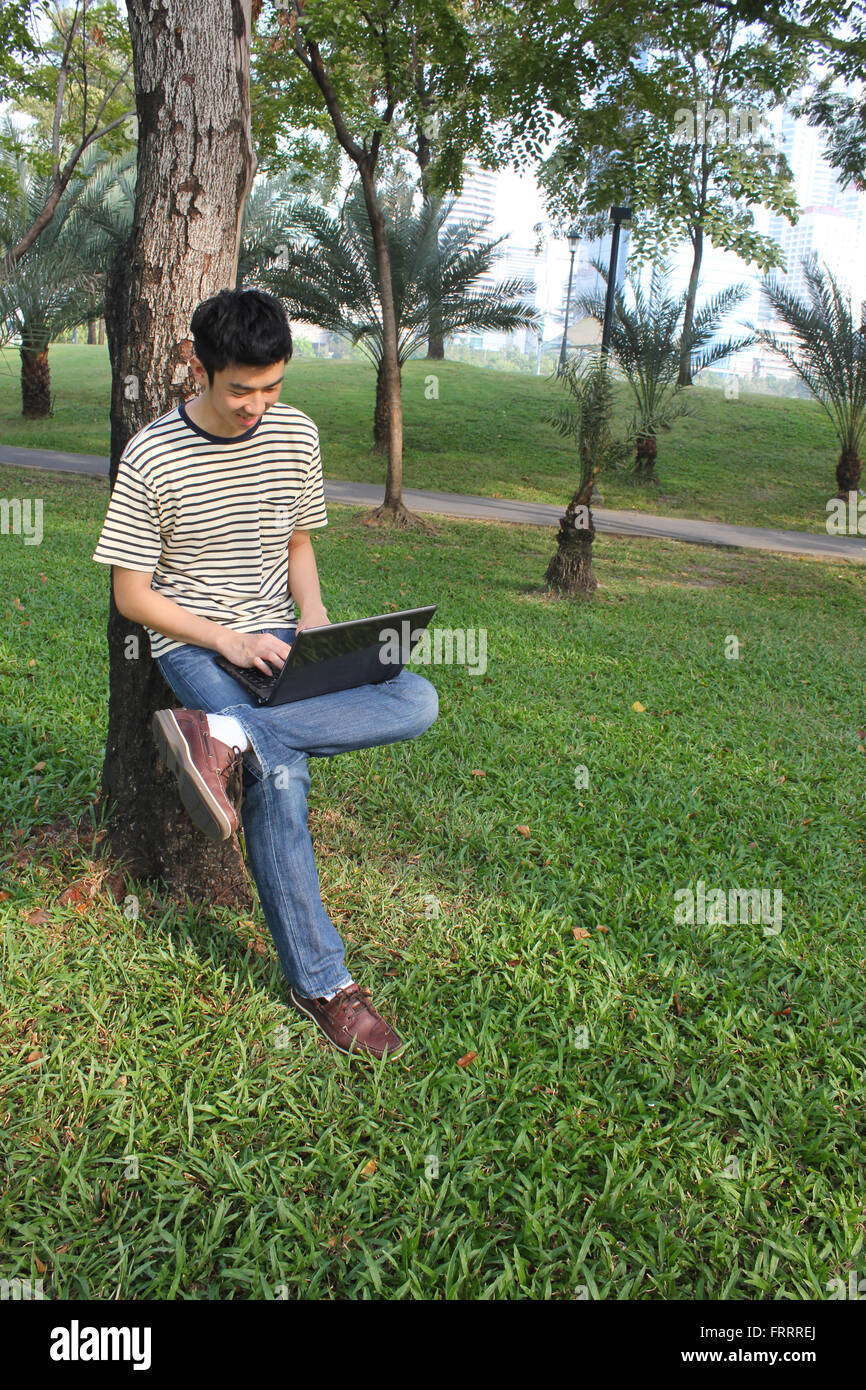 Learning in the park Stock Photo - Alamy