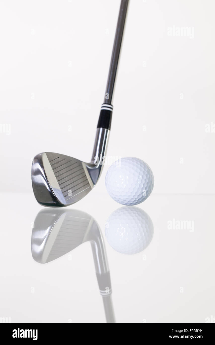 Golf club and golf ball on the glass table Stock Photo - Alamy