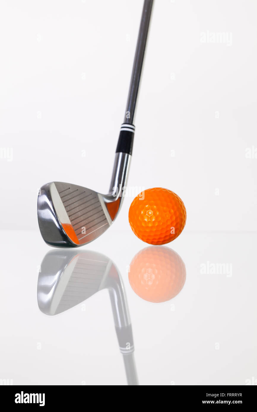 Golf club and golf ball on the glass table Stock Photo - Alamy