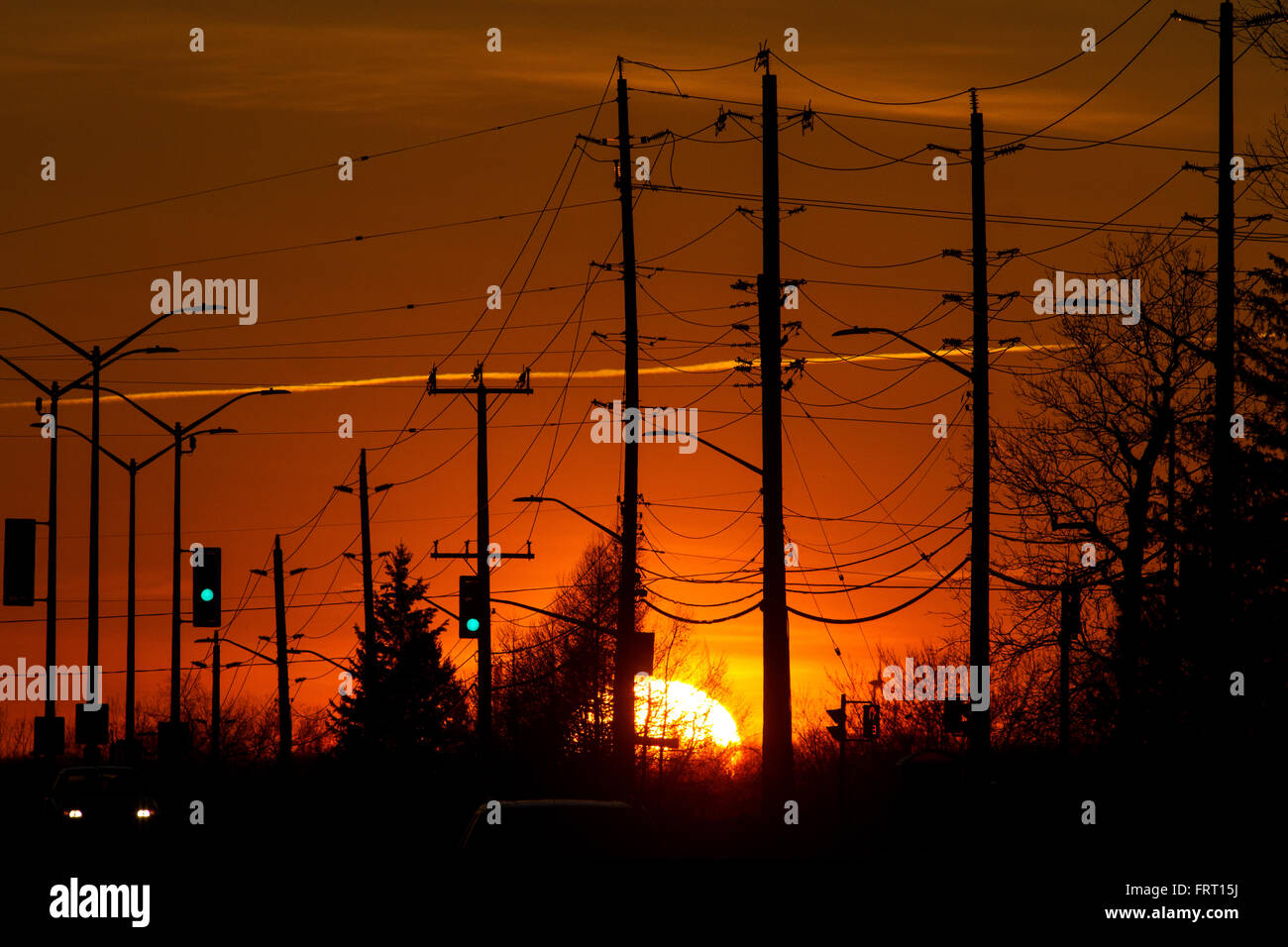 Electrical power line seen during sunset in Kingston, Ont., on March 18 ...