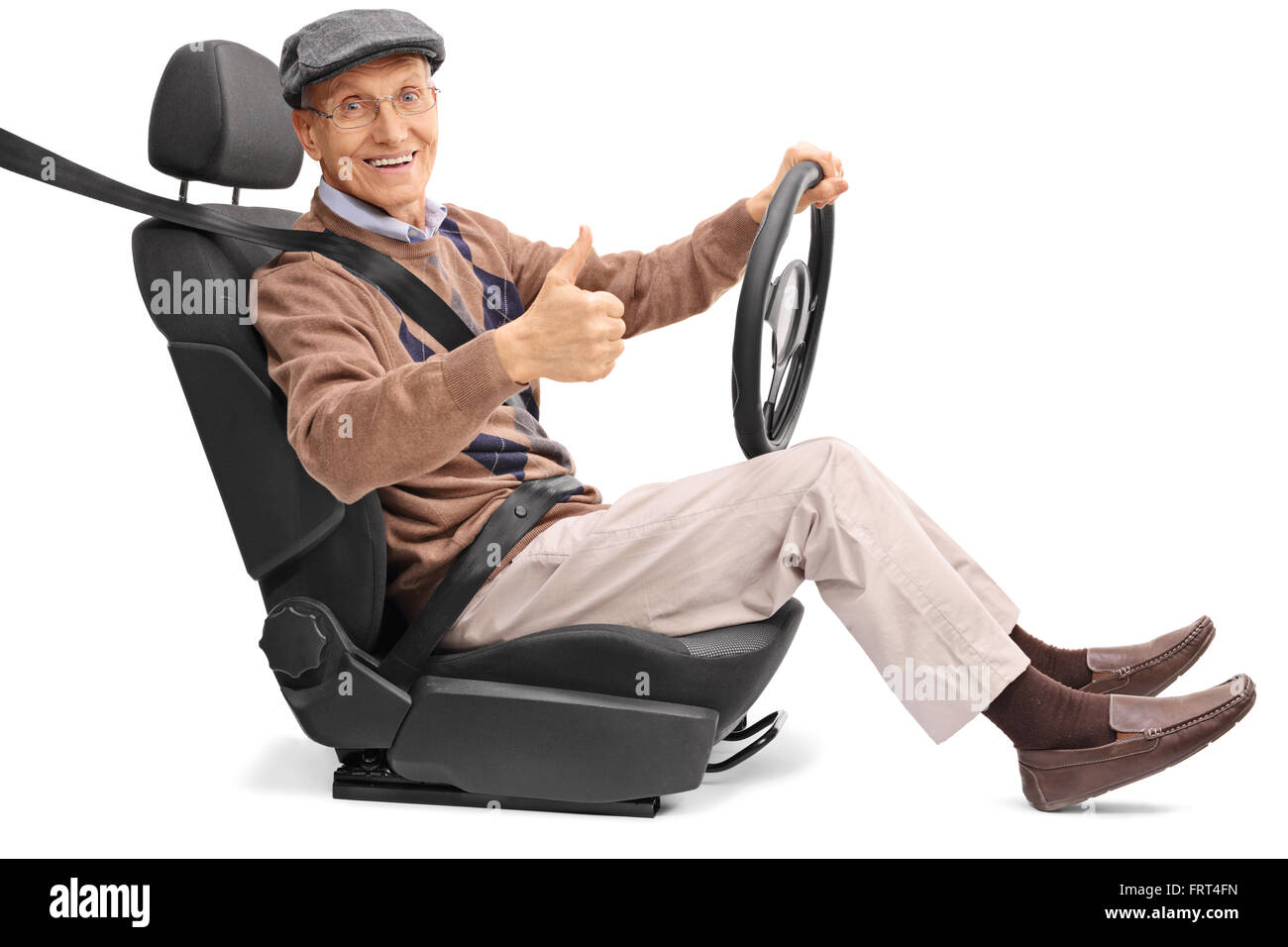 Cheerful senior driving and giving a thumb up isolated on white ...