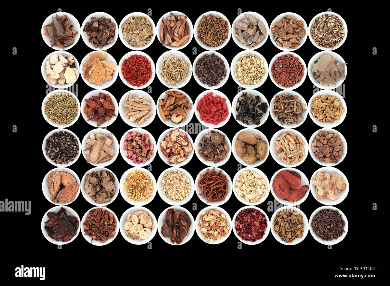 Large traditional chinese herbal medicine selection in porcelain bowls ...