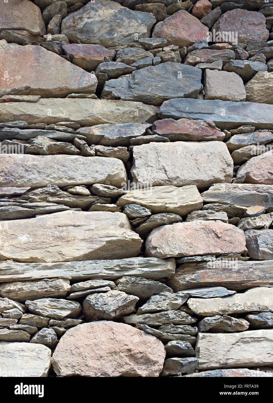 Traditional Georgian wall stacked from mountain rocks. background Stock ...