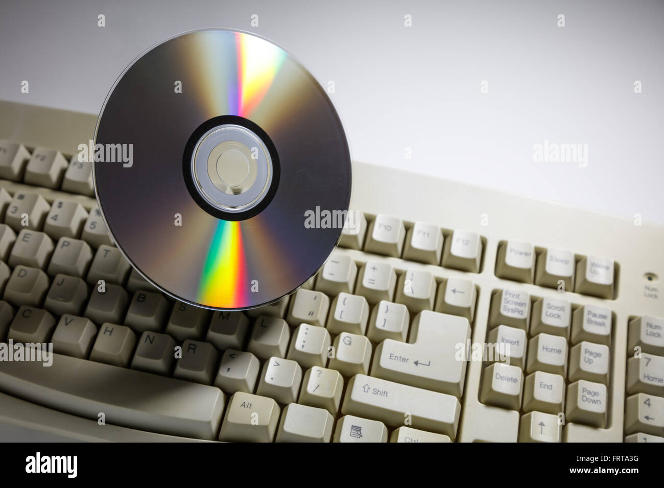 computer keyboard and DVD disk, technology concept Stock Photo - Alamy