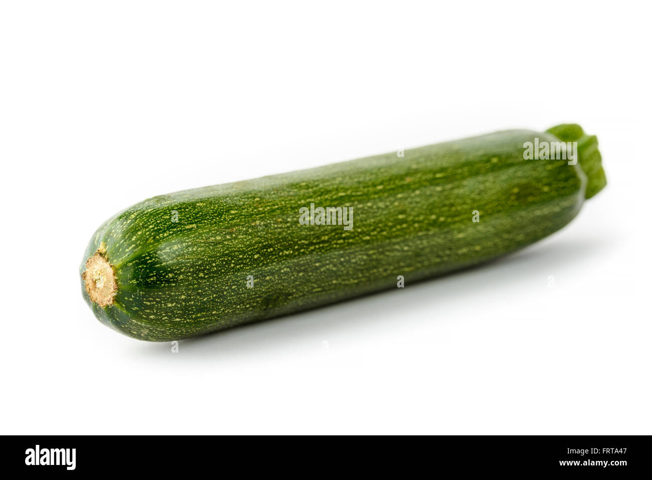single fresh zucchini on white background Stock Photo - Alamy