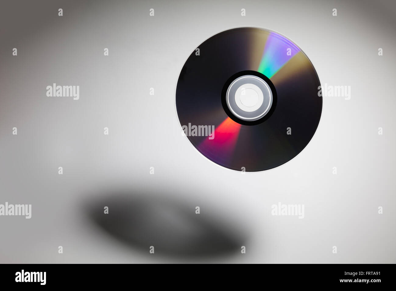 a CD , DVD disk with dark shadow , technology concept Stock Photo - Alamy