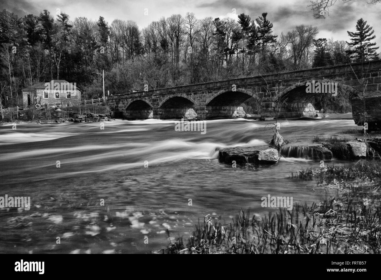 Mississippi River flowing under the five-span stone bridge in Pakenham ...