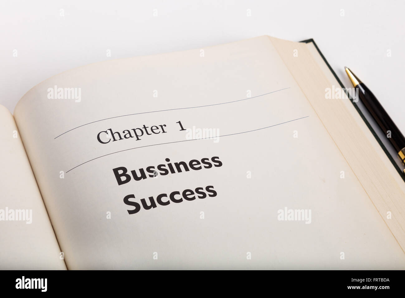 chapter one, in an open book with a pen, business success, fake book ...