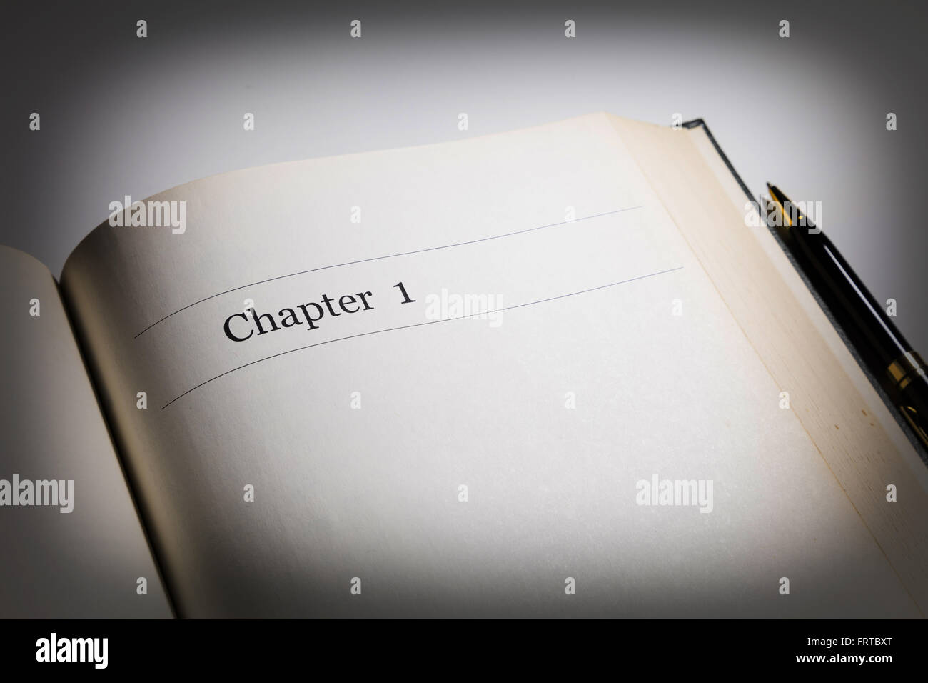 chapter one, in an open book with a pen Stock Photo - Alamy