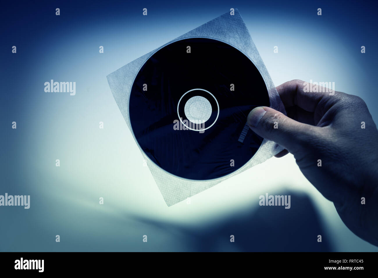 Hand holding a CD , DVD disk, technology concept Stock Photo - Alamy