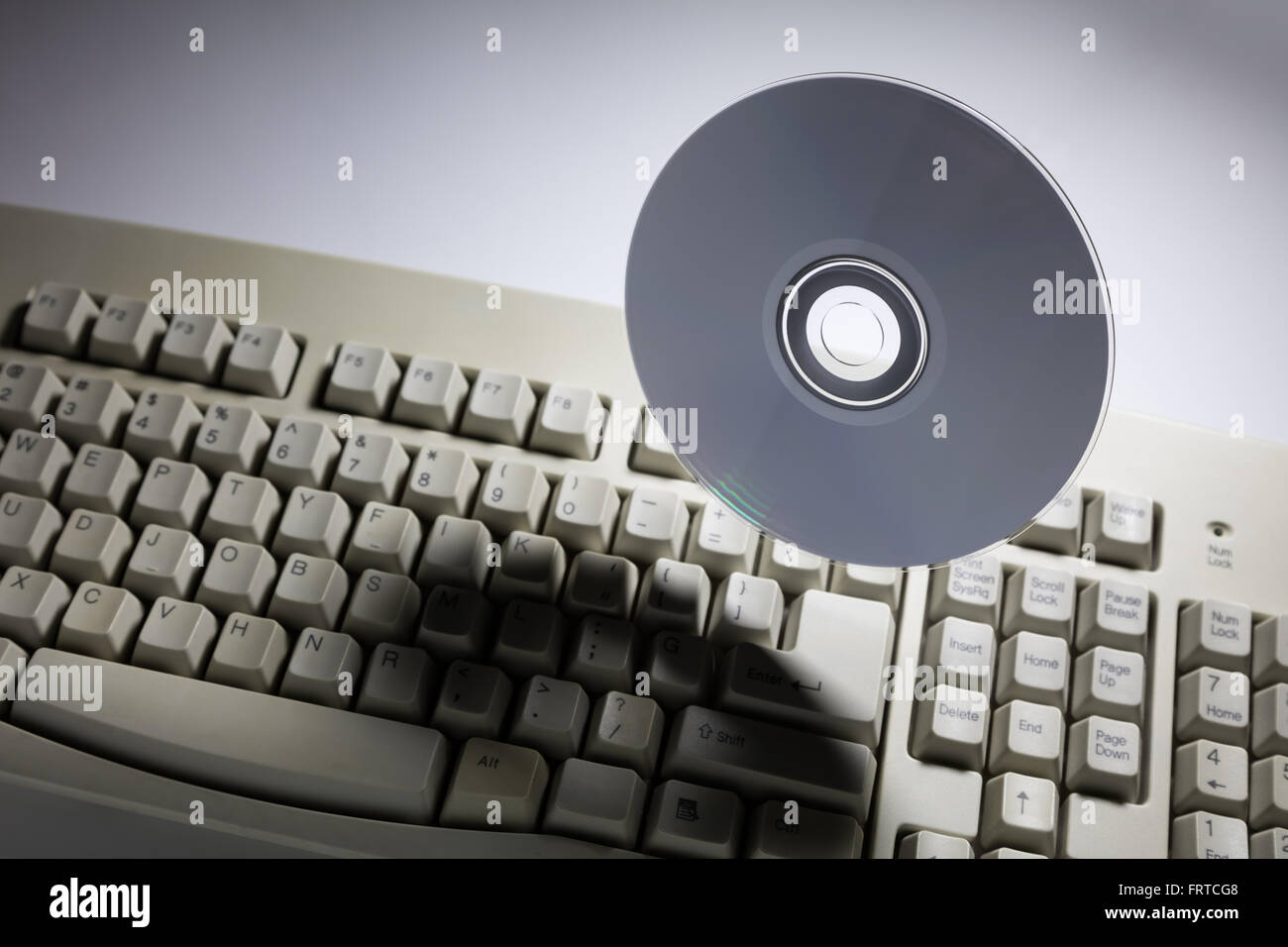 computer keyboard and DVD disk, technology concept Stock Photo - Alamy