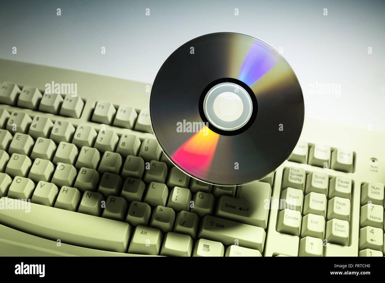 computer keyboard and DVD disk, technology concept Stock Photo - Alamy