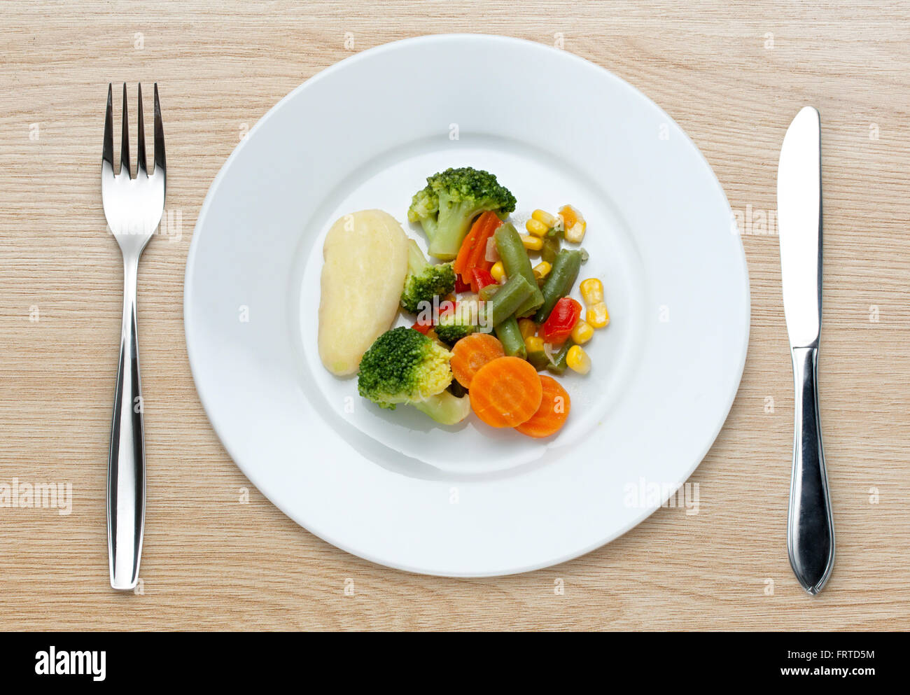 Fried vegetables on the plate in closeup Stock Photo - Alamy