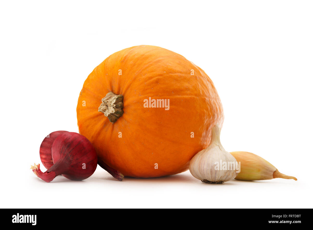 Pumpkin, onion and garlic in closeup on the white background Stock ...