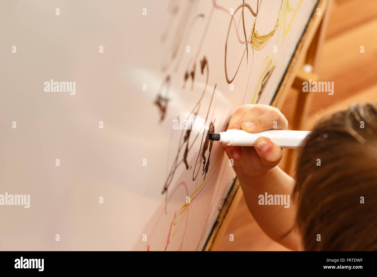 Child's hand drawing with marker on blackboard Stock Photo - Alamy