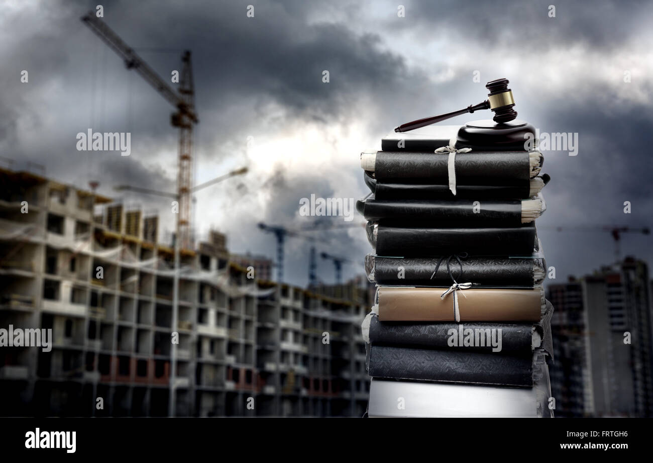 Document files with gavel on buildings under construction Stock Photo ...