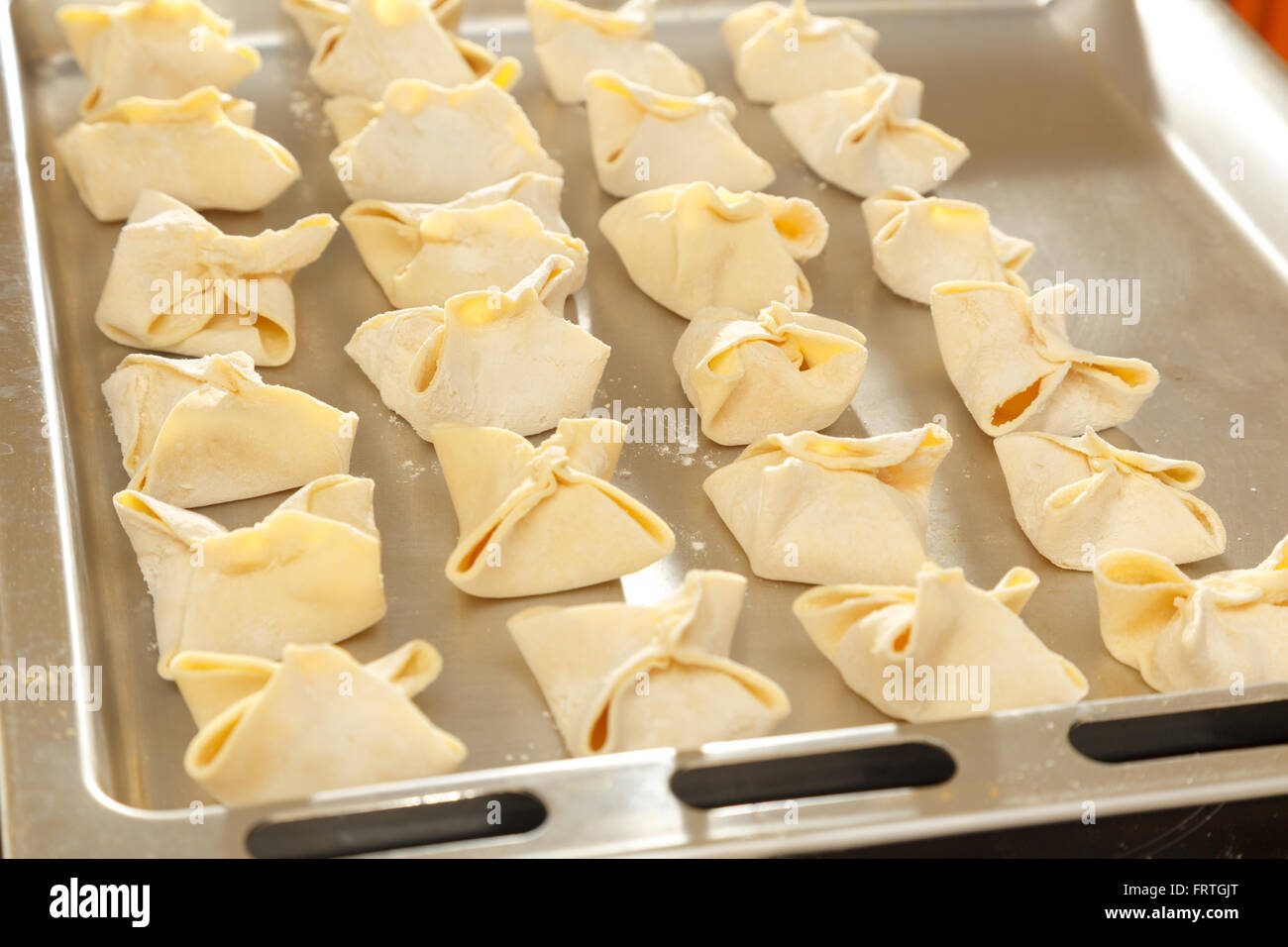 Baking sweet cakes process of dough closeup Stock Photo - Alamy