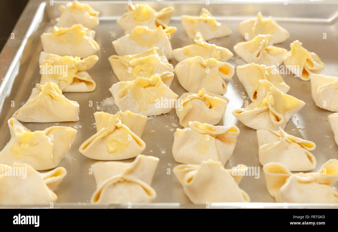 Baking sweet cakes process of dough closeup Stock Photo - Alamy
