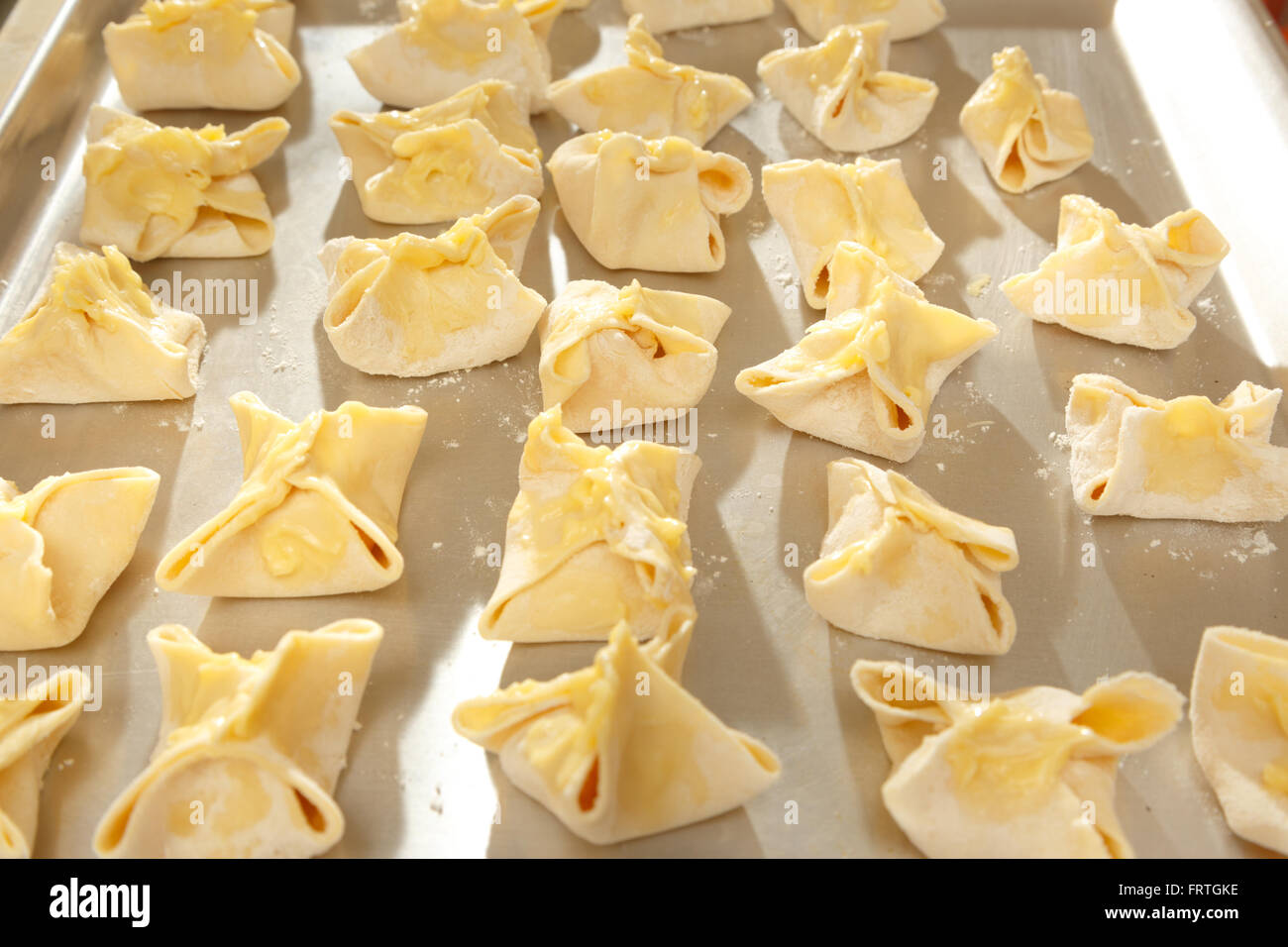 Baking sweet cakes process of dough closeup Stock Photo - Alamy