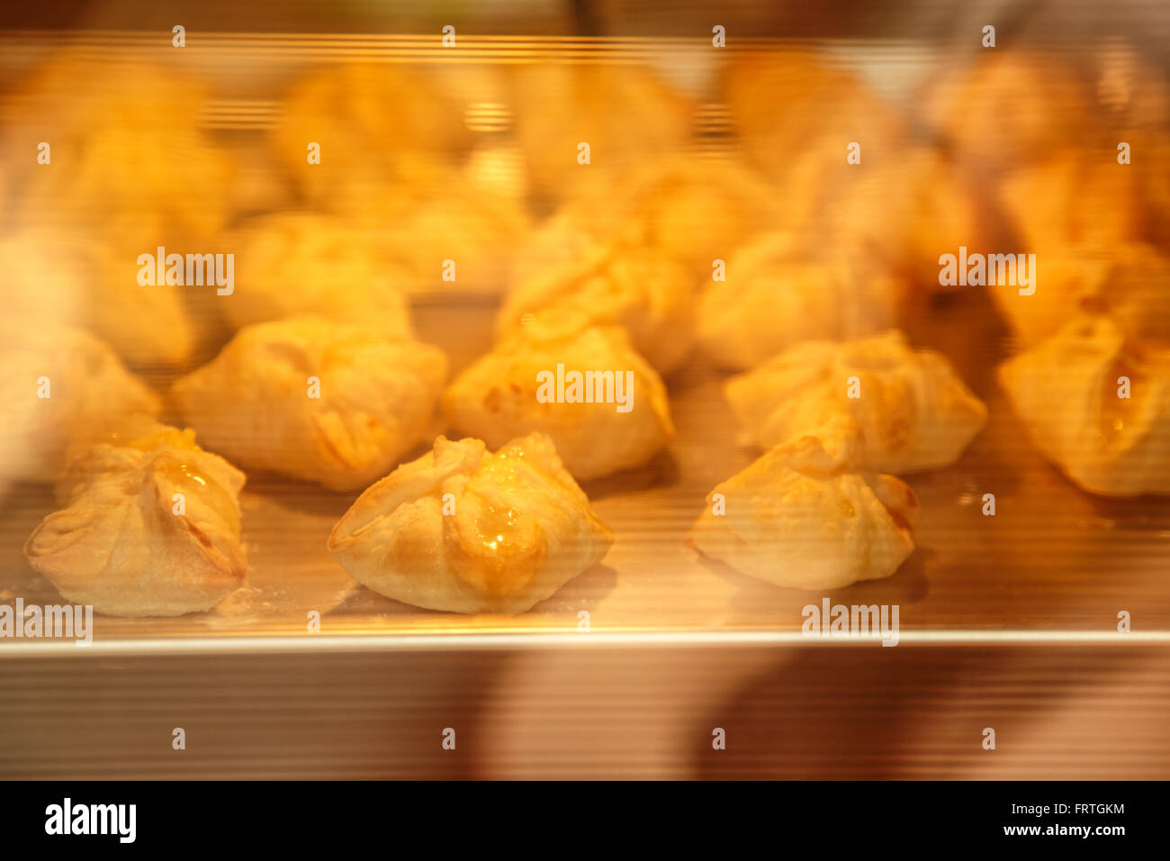 Homemade sweet buns on baking tray ready Stock Photo - Alamy