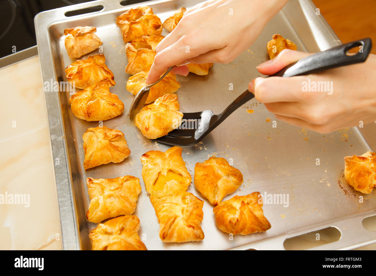 Homemade sweet buns on baking tray ready Stock Photo - Alamy