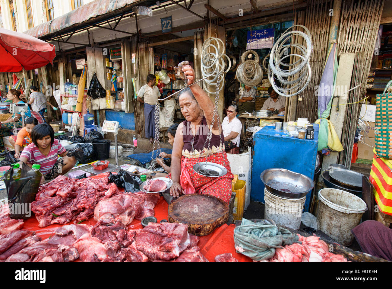 Meat seller at the Thiri Mingala Market in Yangon, Myanmar Stock Photo ...