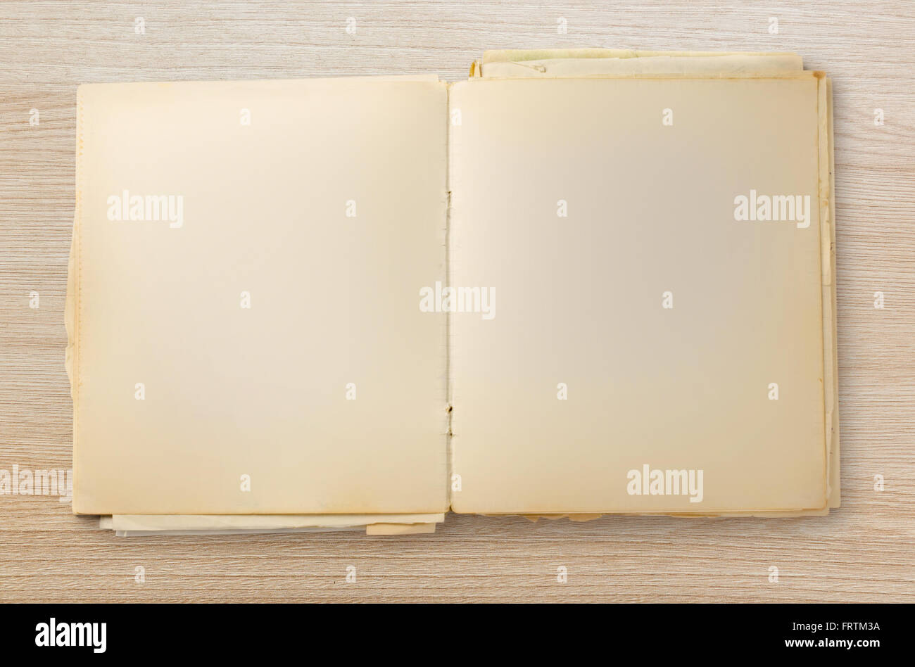 Old blank notebook open on wooden background Stock Photo - Alamy