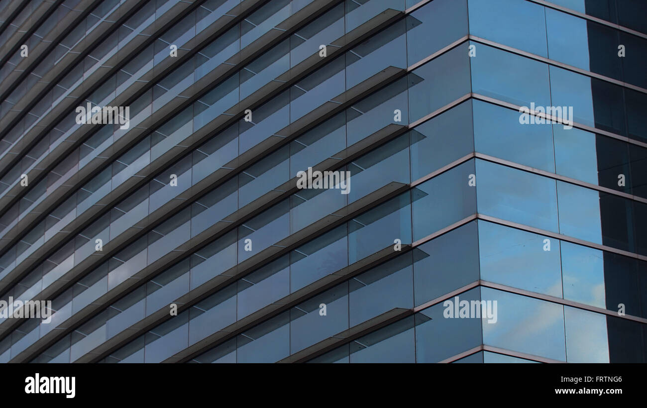 Modern building with glass windows reflected sky Stock Photo - Alamy