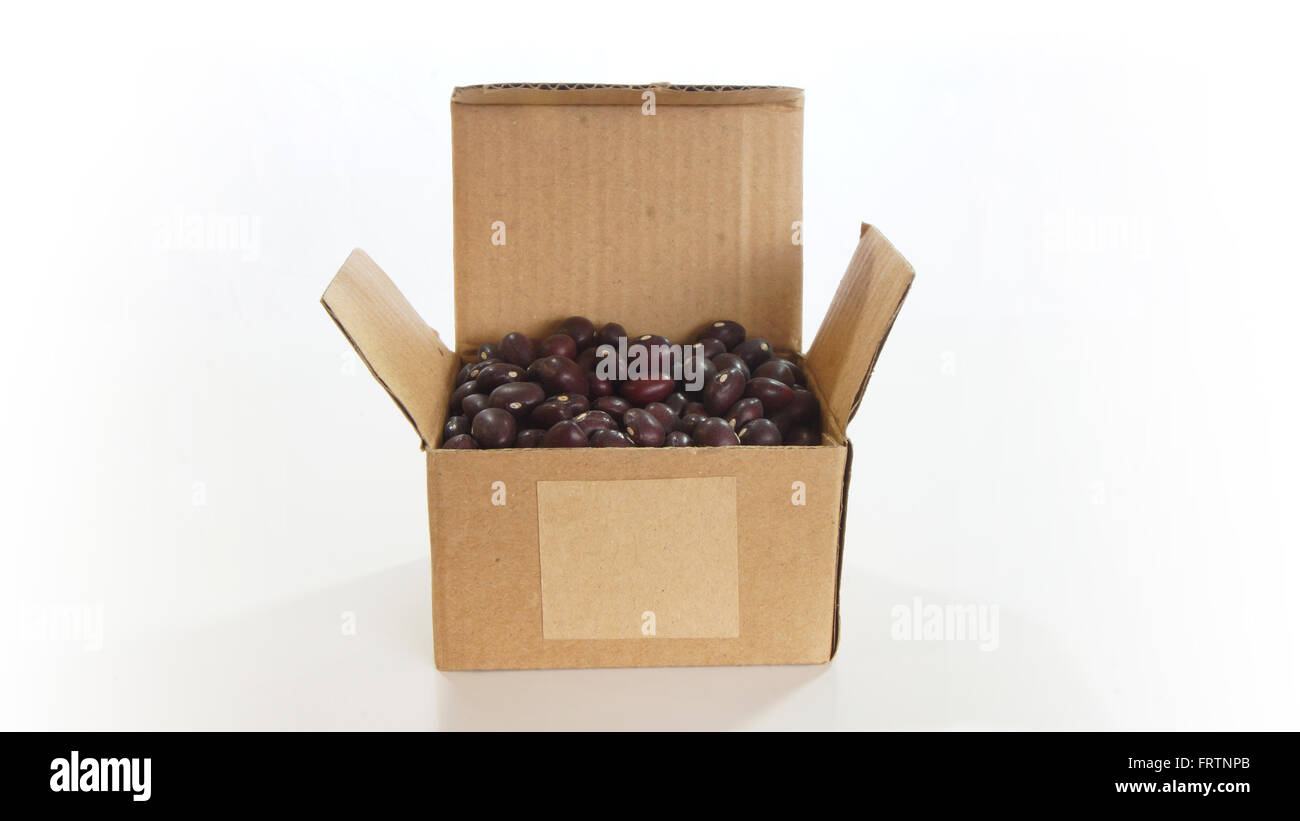 Corrugated cardboard box open with black beans (Phaseolus vulgaris ...