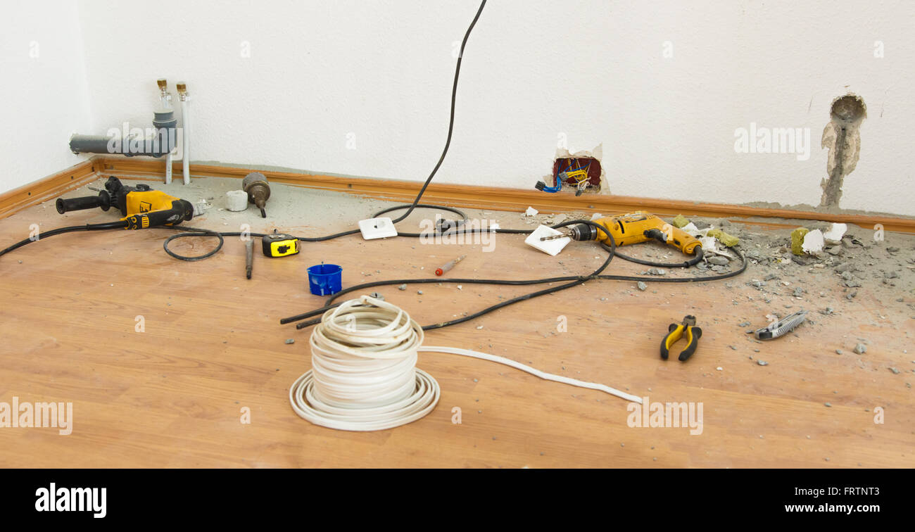 Place of electric socket repair process with drill Stock Photo - Alamy