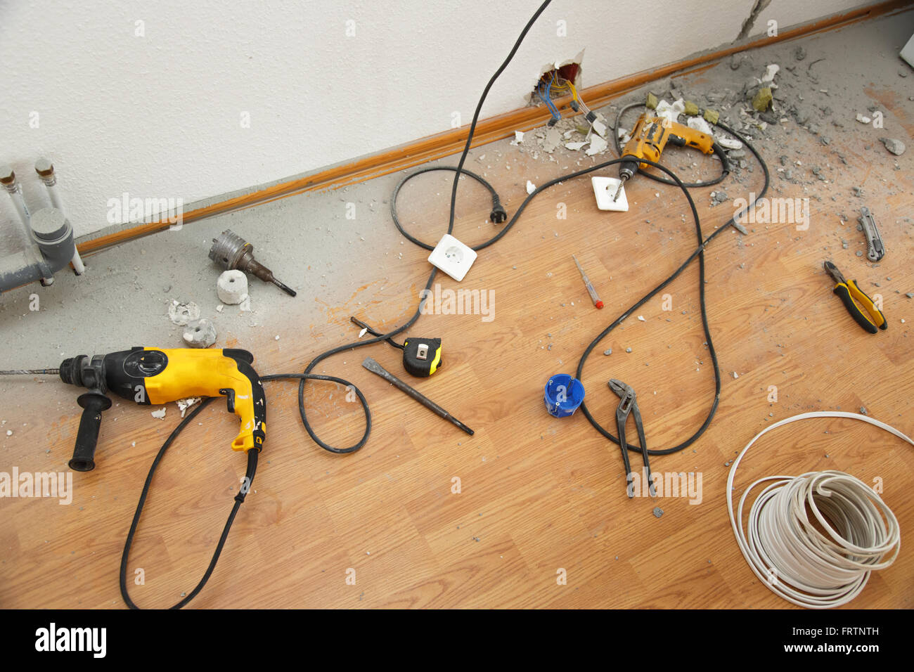 Place of electric socket repair process with drill Stock Photo - Alamy