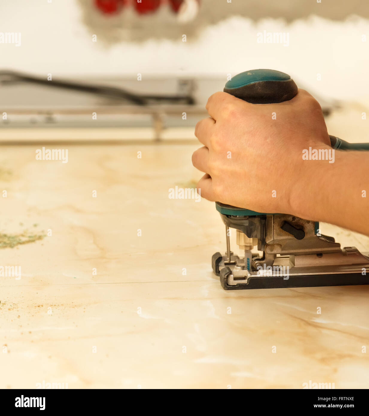 Installing new induction hob in modern kitchen Stock Photo - Alamy