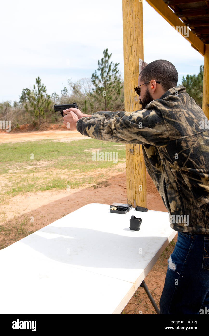 Man holding shooting target hi-res stock photography and images - Alamy