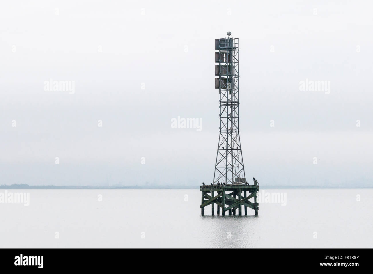 Fog horn and boating hazards warning tower at Texas City Dike Stock ...