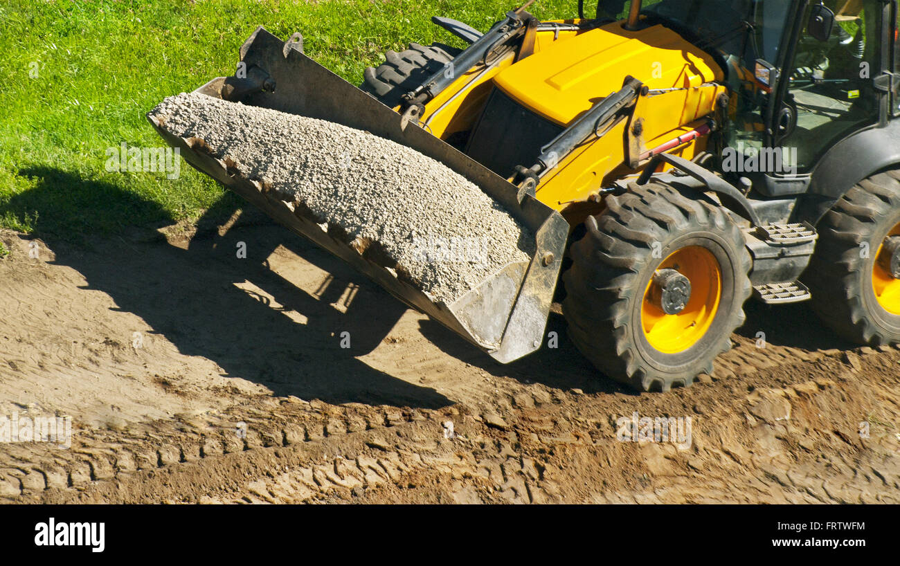 Tractor stone gravel loading machine hi-res stock photography and ...