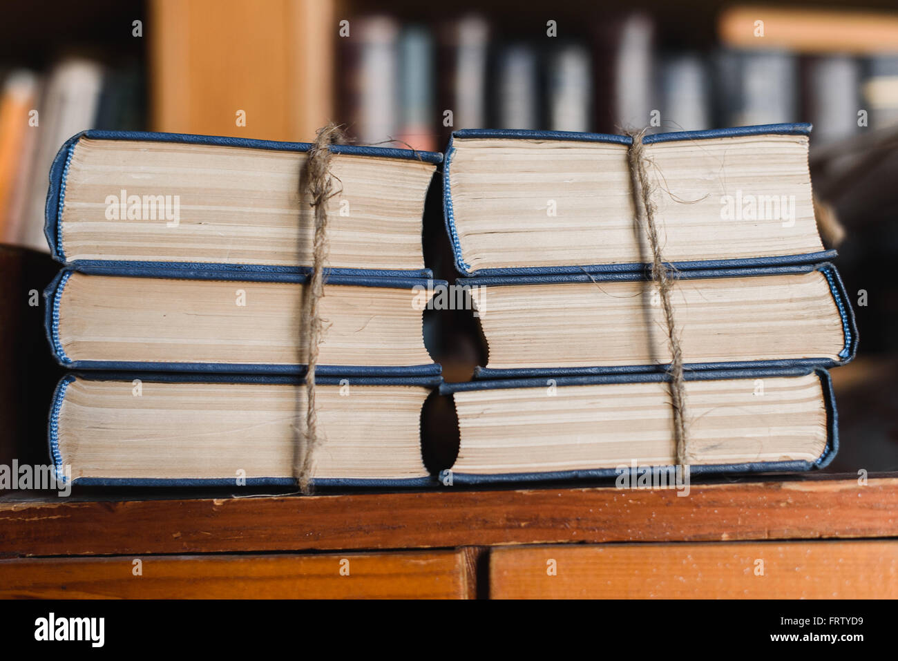 Big stacks of books in the library close up Stock Photo - Alamy