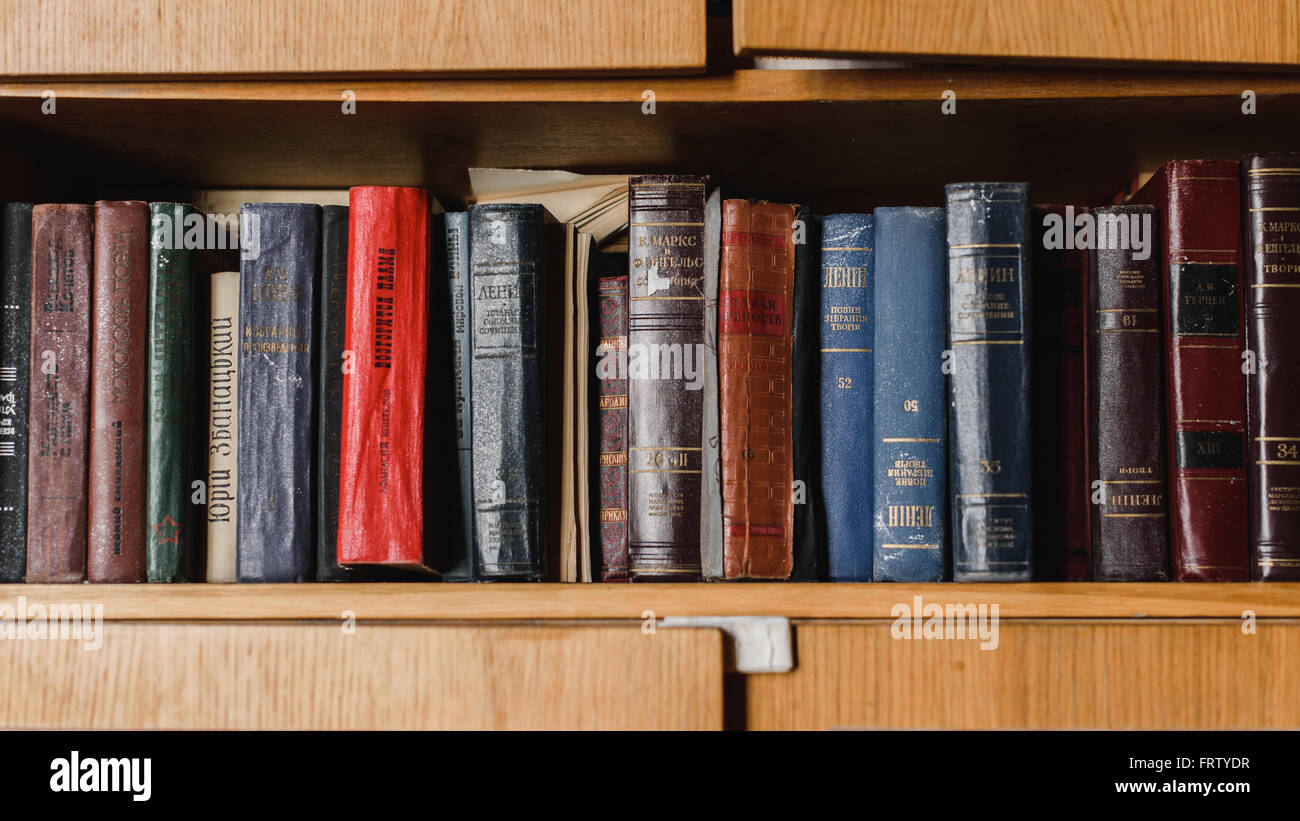 Big stacks of books in the library close up Stock Photo - Alamy